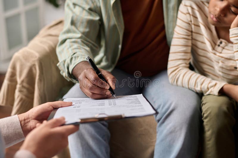 Black Man Signing Document Clipboard Clinic Stock Photos - Free ...