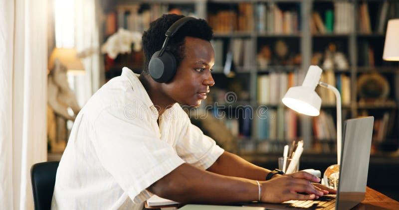 Black Man, Studying and Typing on Laptop, Home and Reading with E ...