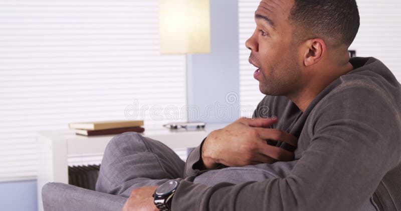 Black Man Talking To Person Off Camera Stock Footage - Video of smiling ...