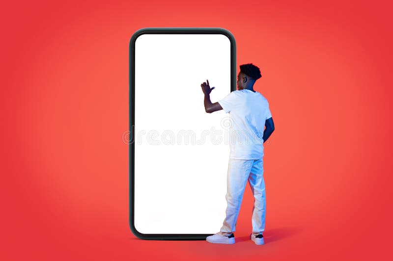 Black Man Touching Empty White Screen of Huge Smartphone Stock Photo ...
