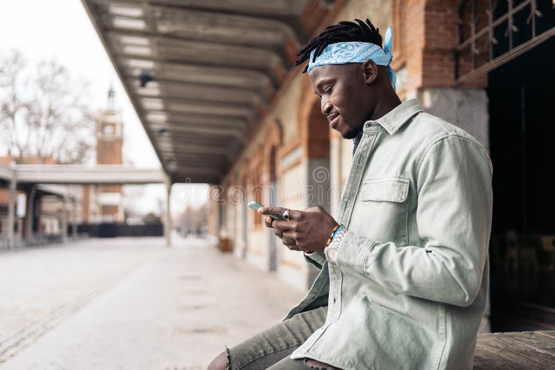 Black Man Using Cellphone stock image. Image of ethnicity - 265105599
