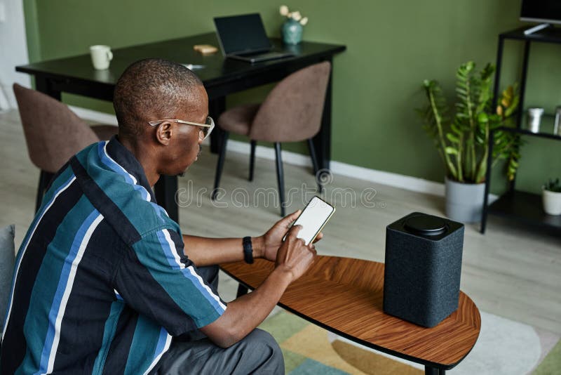 Black Man Using Smart Speaker at Home Stock Image - Image of internet ...
