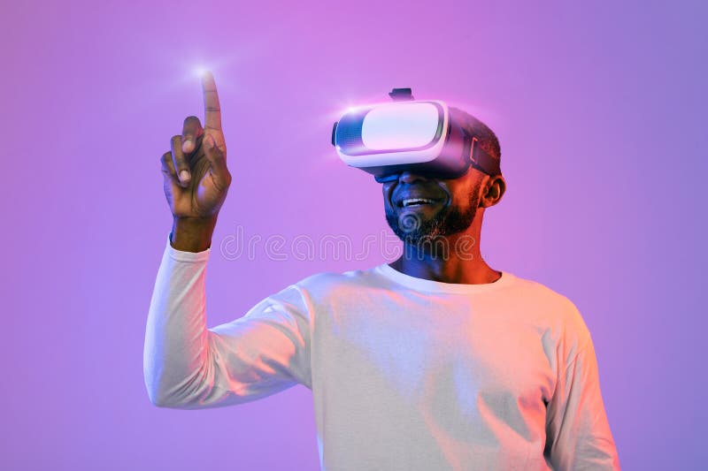 Black Man in VR Headset Touching Something Invisible Stock Photo ...