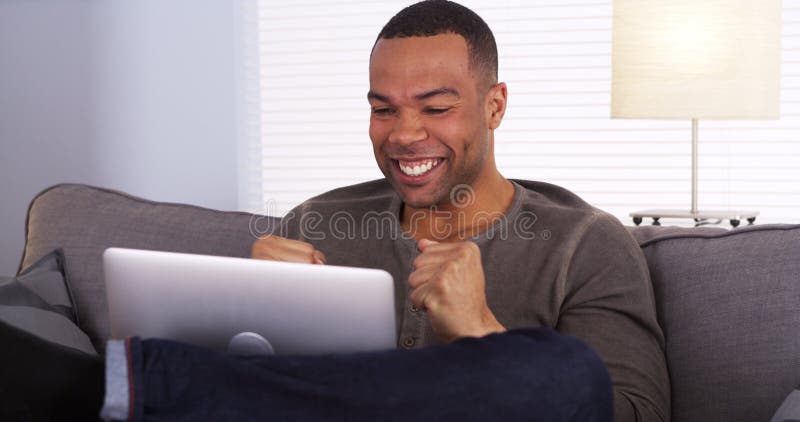 Black Man Watching the Game on His Laptop Stock Image - Image of ...