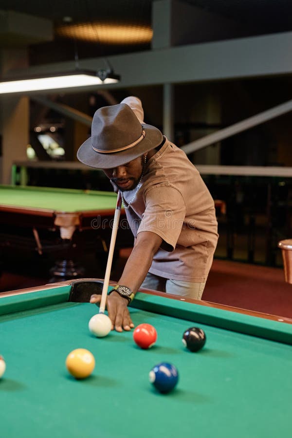 Black Man Wearing Hand and Playing Pool at Pool Table Stock Photo ...