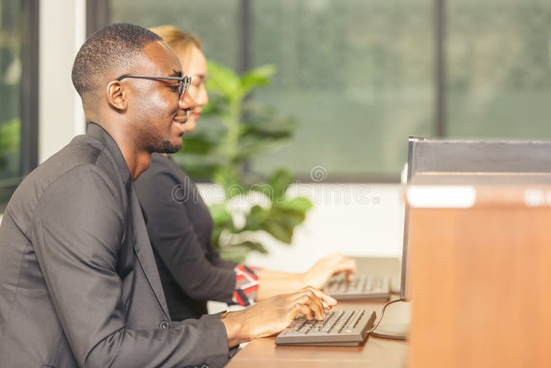 A Black Man Works on a Tablet Computer in the Hotel Lobby Stock Image ...