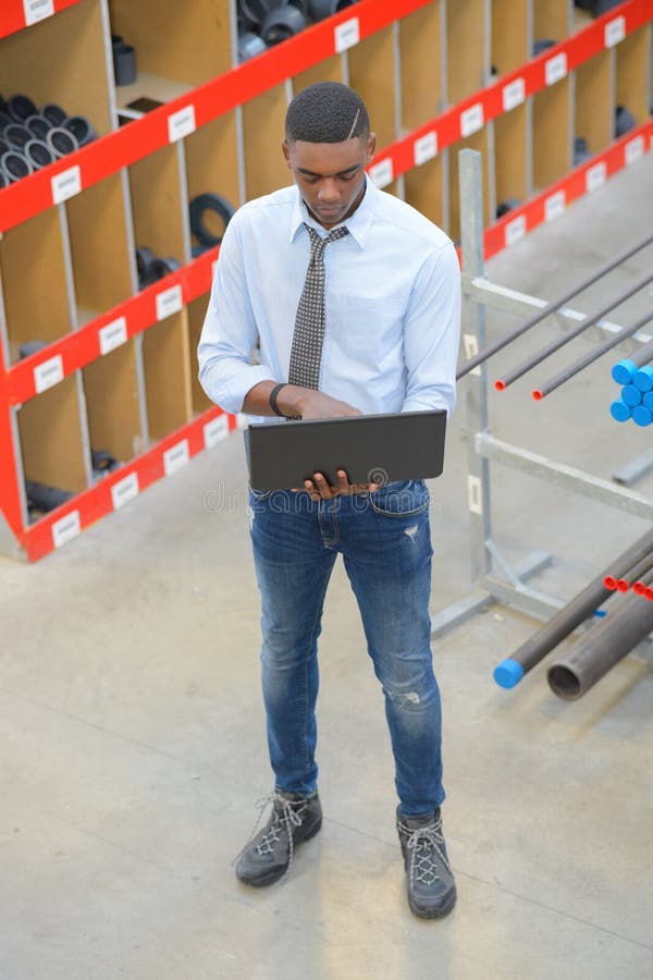 Black Manager with Laptop in Warehouse Stock Photo - Image of talking ...