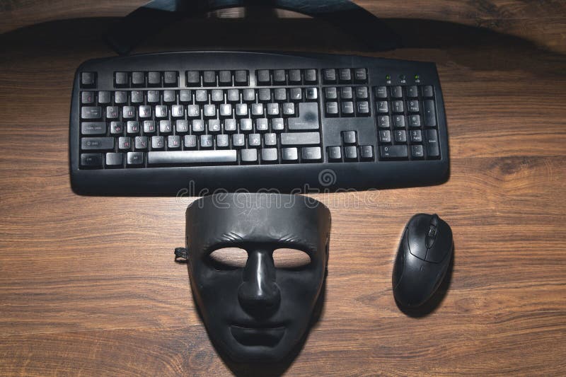 Black Mask and Computer on the Table Stock Image - Image of ...