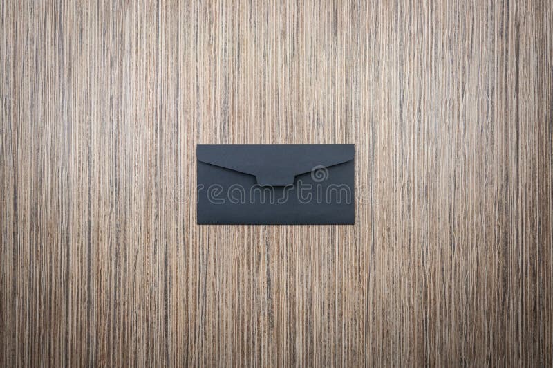 Black Single Envelope on Wooden Table. Top View Stock Image - Image of ...