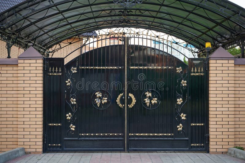 Black Metal Forged Gates in Black Stock Photo - Image of metal, gates ...