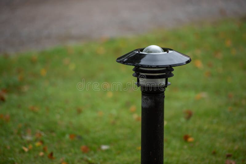 A Black Metal Lamp Post by a Field.. Stock Photo - Image of post, night ...
