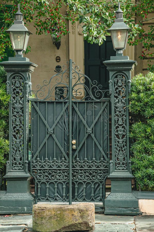 Black Metal Posts with Gas Lights and Gates with Canvas Sheets Stock ...