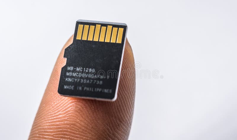 Micro SD Card on Finger Tip Editorial Image - Image of scaled, tiny ...