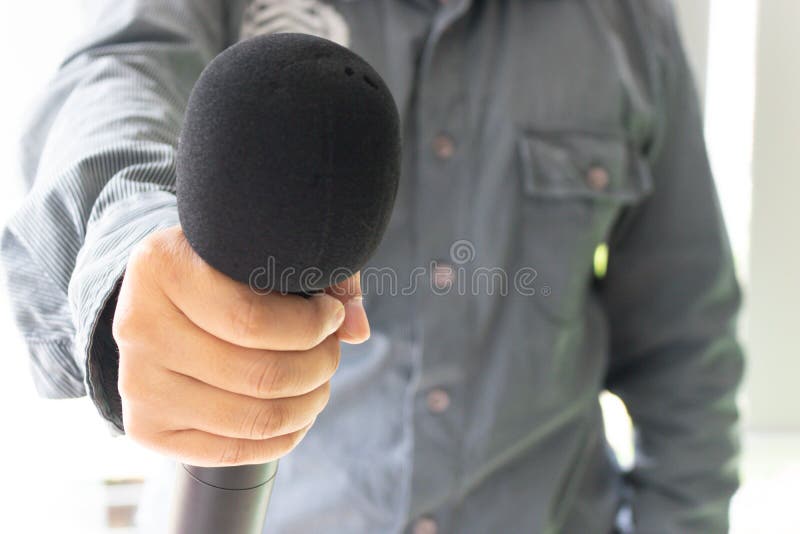 Black Microphone in a Hand of Man Stock Photo - Image of reporter ...