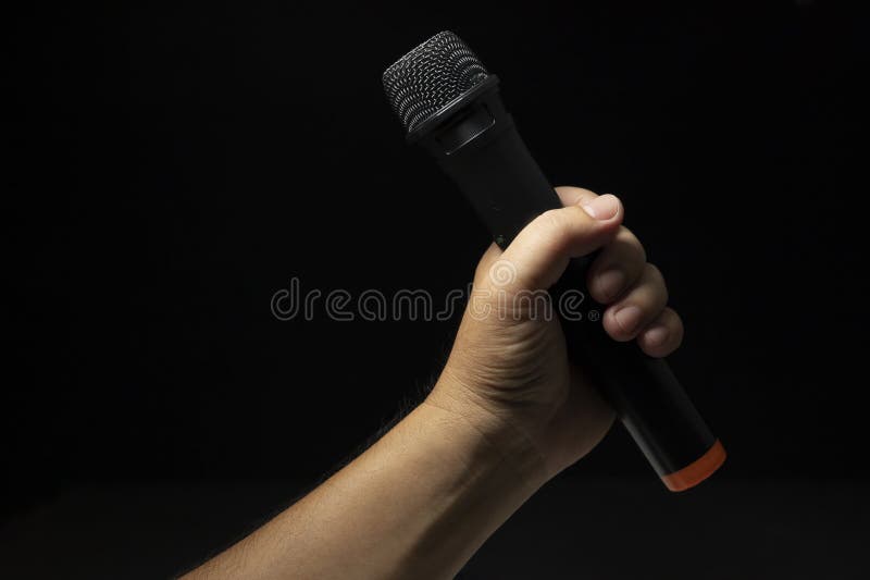 Black Microphone Male Singer S Hand Holding Microphone on Modern ...