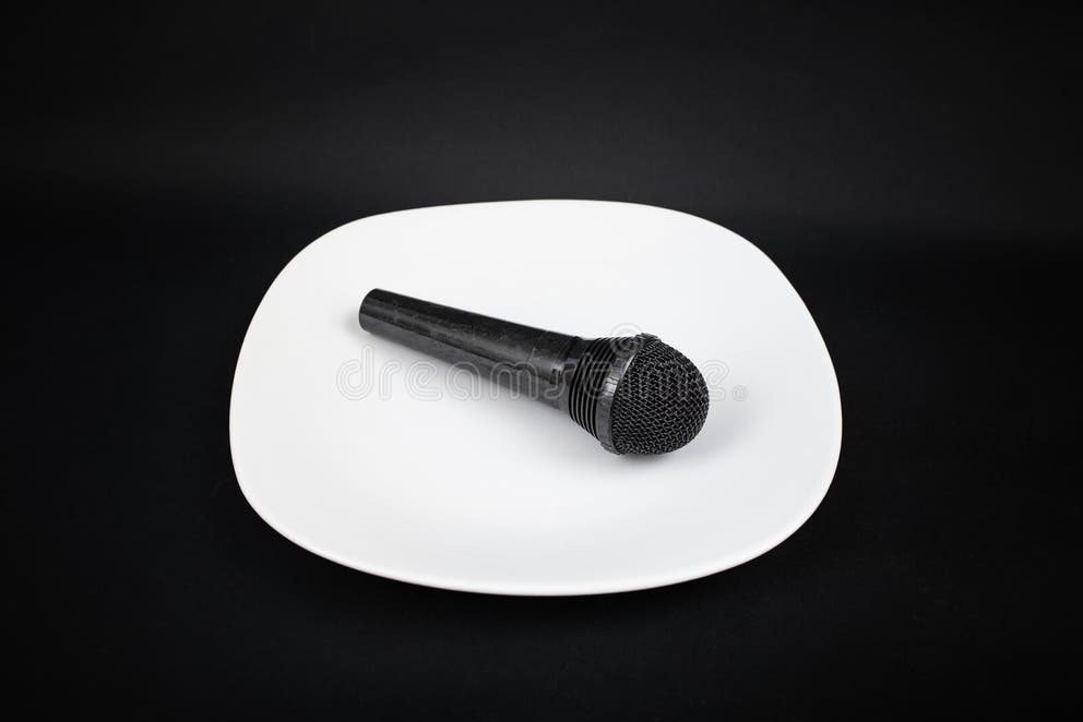 Black Microphone on White Plate, Minimal Musical Backdrop Stock Image ...