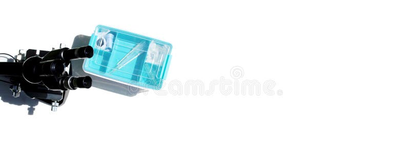 Black Microscope on a White Background, Horizontal View, Cropped Shot ...