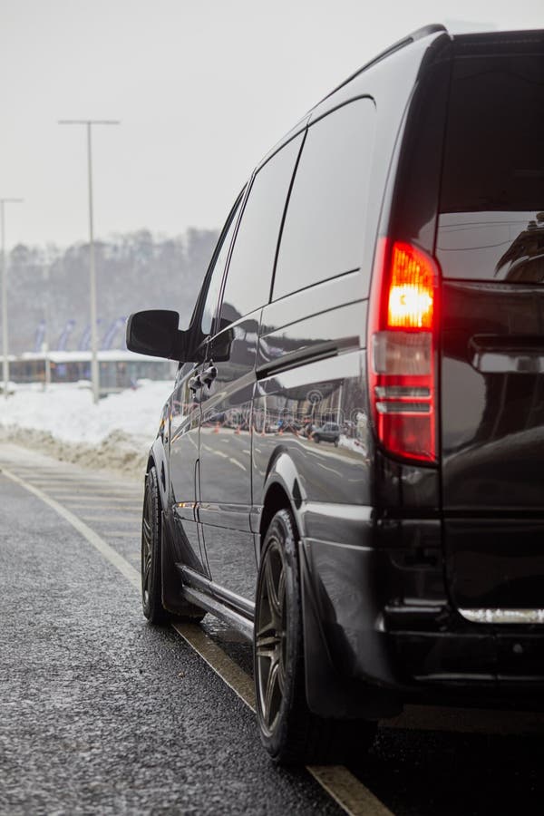 Black Minivan on Road on Winter Day, Rear Side Stock Photo - Image of ...