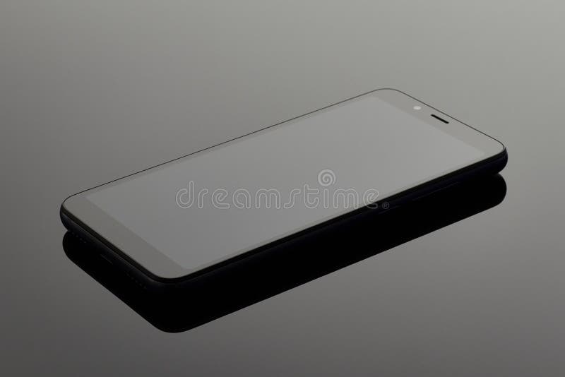 Black Mobile Smartphone on the Surface with Reflection Stock Photo ...
