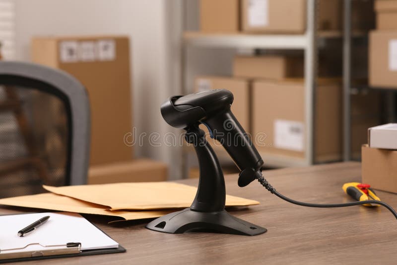Black Modern Barcode Scanner on Wooden Table in Office. Online Store ...