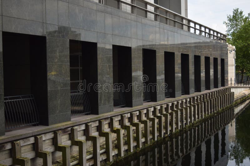 Black Modern Building by the Water with Open Windows Stock Photo ...