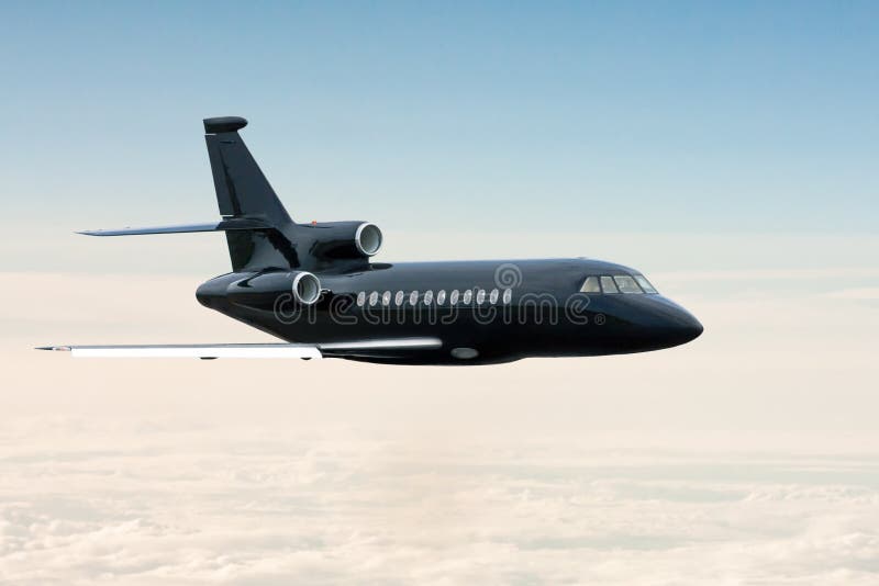 Black Modern Private Jet Flying in the Air Above the Clouds Stock Photo ...