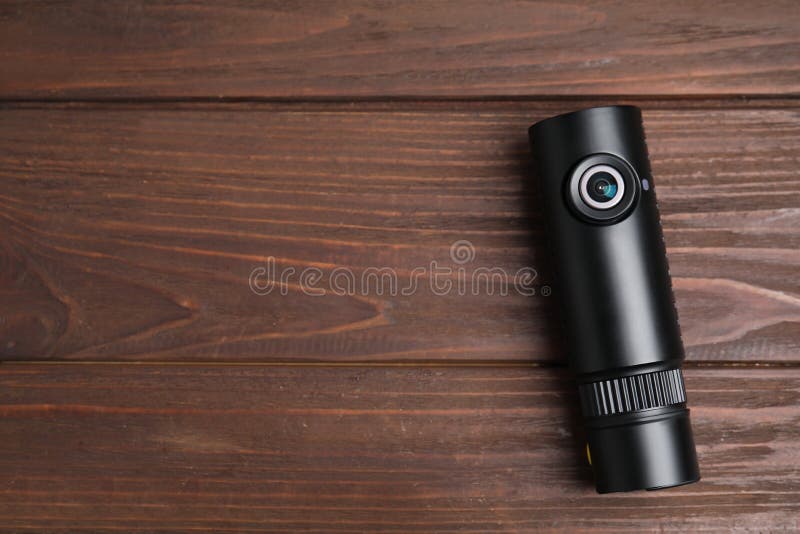 Black Modern Car Camera on Wooden Table, Top View. Space for Text Stock ...