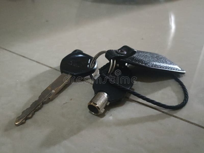 Black Motorcycle Key and a Black Rope Stock Image - Image of metal ...