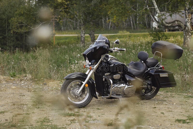 Black Motorcycle Pulled Off the Road To Rest. Stock Image - Image of ...