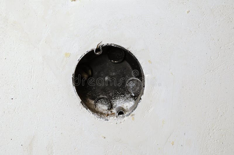 Black Mounting Box for Electrical Outlets in a Light Gray Plaste Stock ...