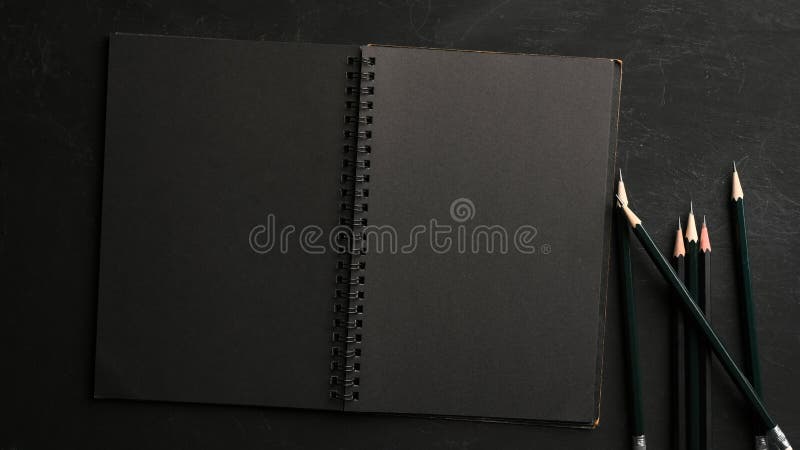 Black Notebook with Black Papers and Pencils on Study Table Stock Image ...