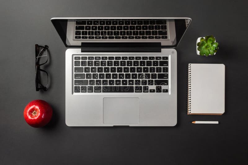 Black Office Desk Table with Blank Screen Laptop Computer, Notebook and ...