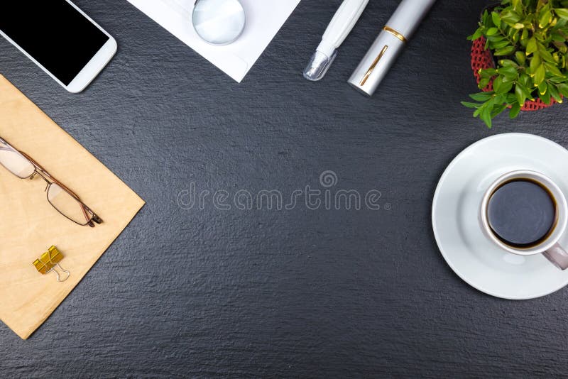 Black Office Desk Table with Computer, Pen and a Cup of Coffee, Lot of ...