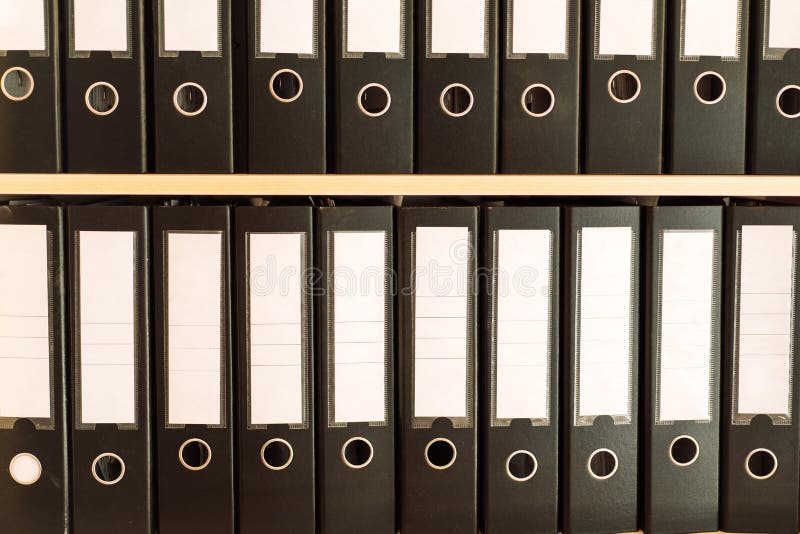 Black Office Folders Standing on Cabinet Shelves Stock Photo - Image of ...