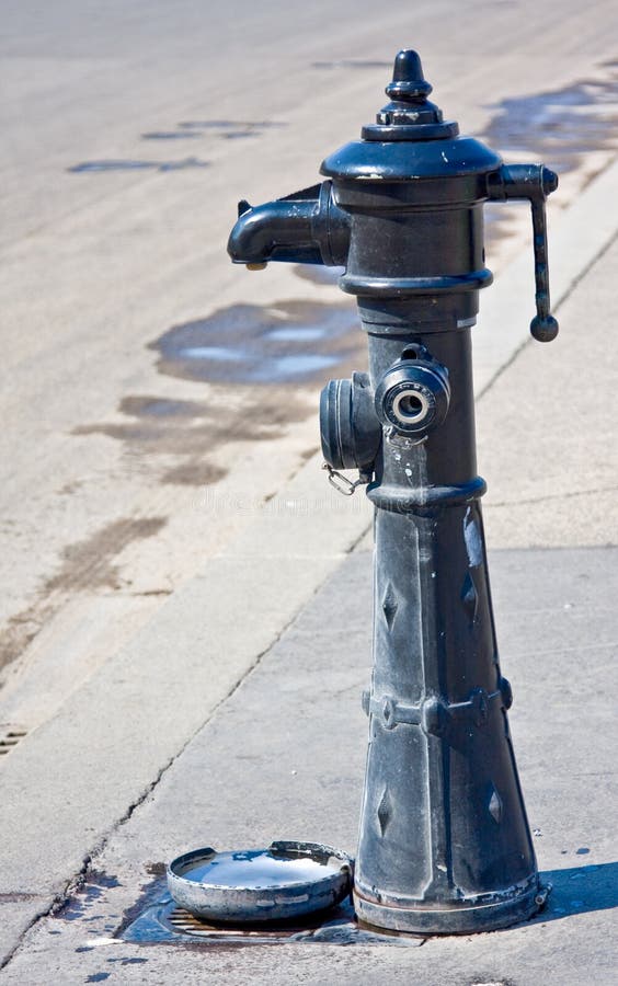 Black Old Hydrant on Strreet in Vienna Stock Photo - Image of puddle ...