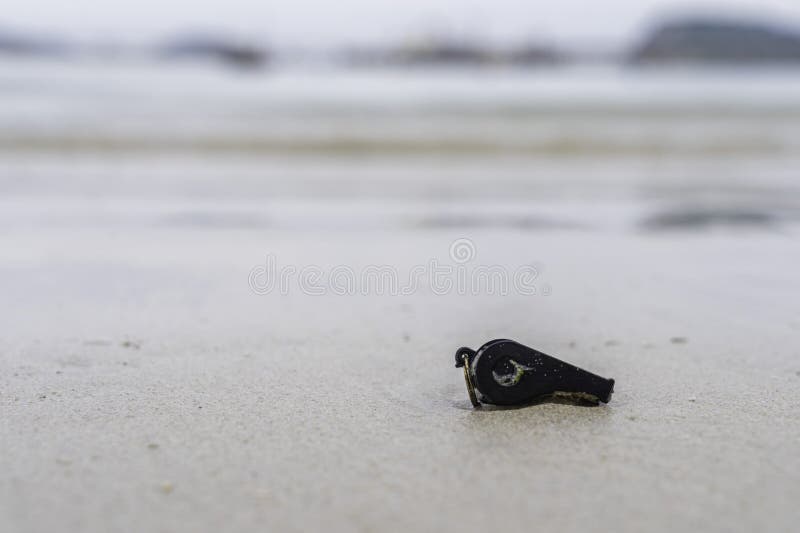 Black Old Whistle Plastic Left on the Beach Stock Image - Image of ...