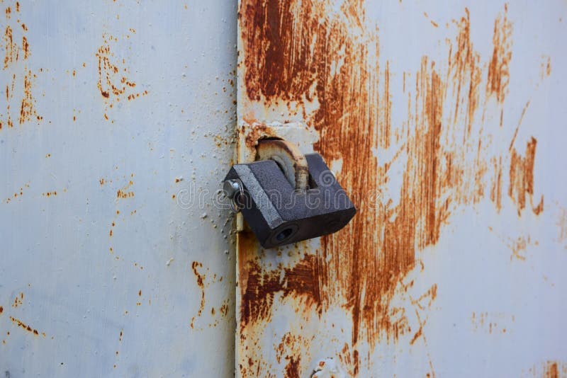 A Padlock Hangs on an Iron Closed Gate with Peeling Paint and Rust ...