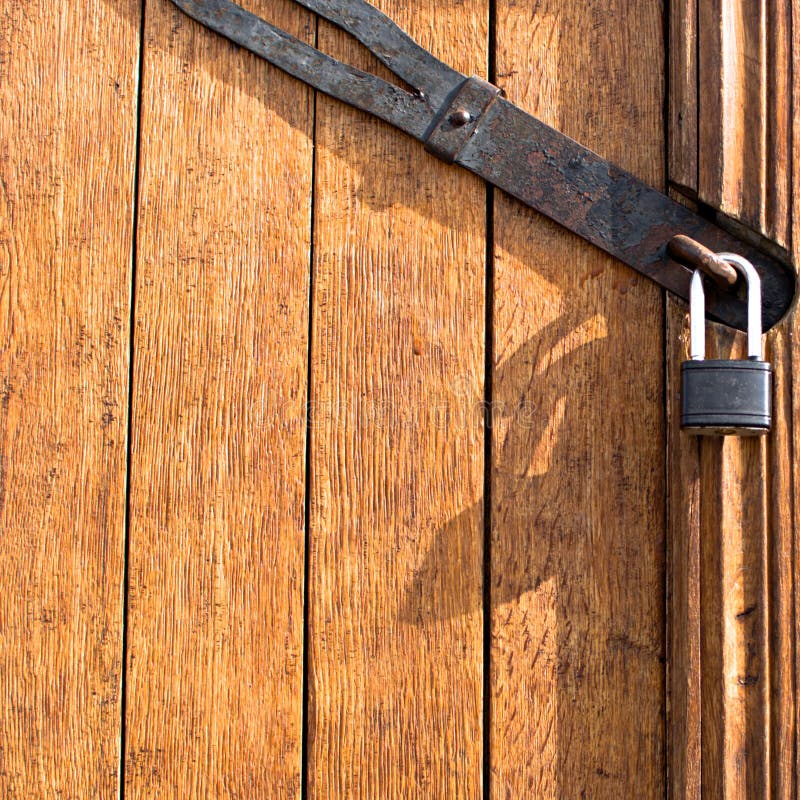 Black Padlock on Wooden Door Stock Photo - Image of retro, rusty: 215086354
