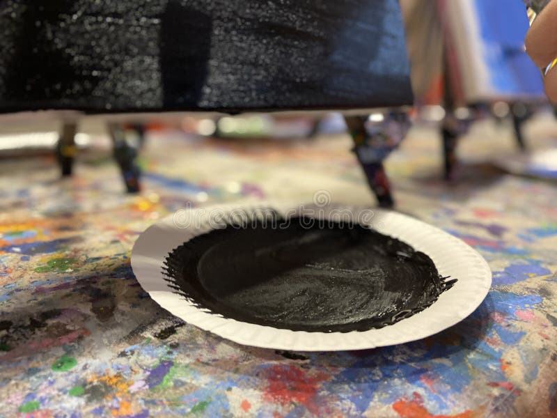 Black paint on a plate stock photo. Image of colorful - 179445992