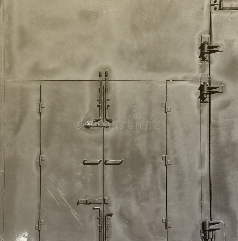 Black Painted Garage Gates with Door Under the Sunlight. Background ...