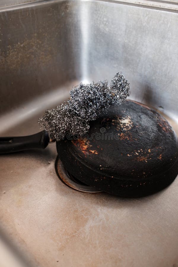 A Black Pan Behind and a Wire Sponge Stock Image - Image of cake ...
