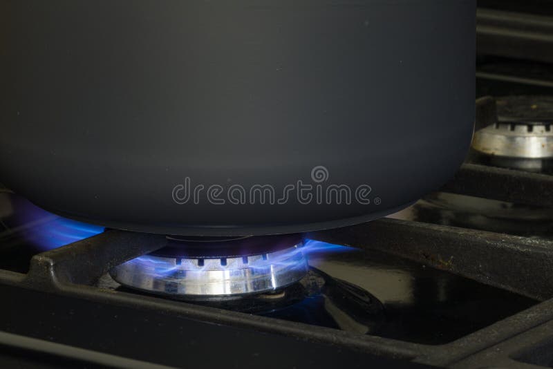A Black Pan Cooking on Natural Gas Stock Image - Image of fuel, burner ...