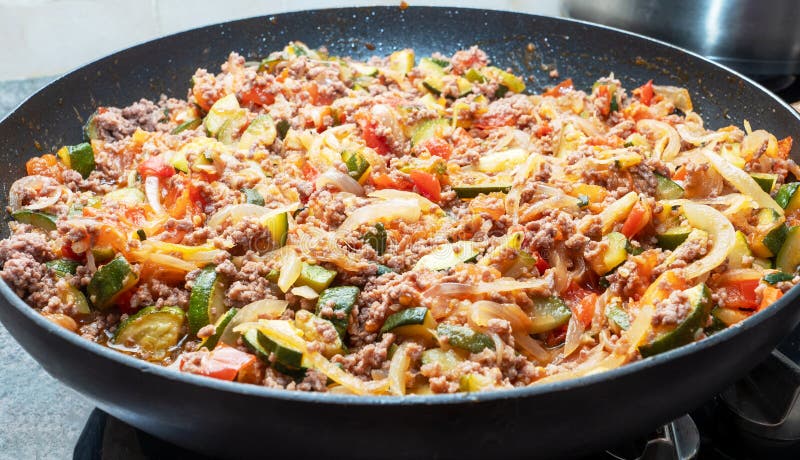 A Black Pan with Meat and Vegetables in it Stock Photo - Image of tasty ...