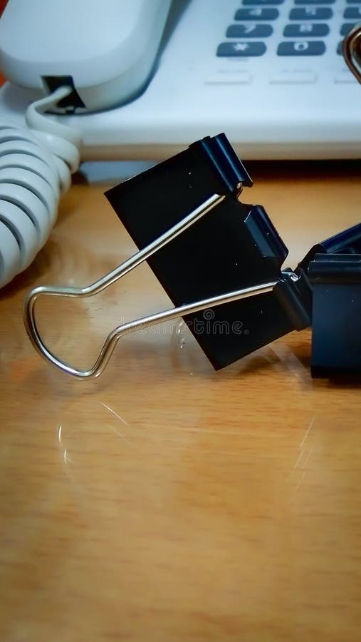 Black Paper Clip on the Office Desk Stock Photo - Image of desk, paper ...
