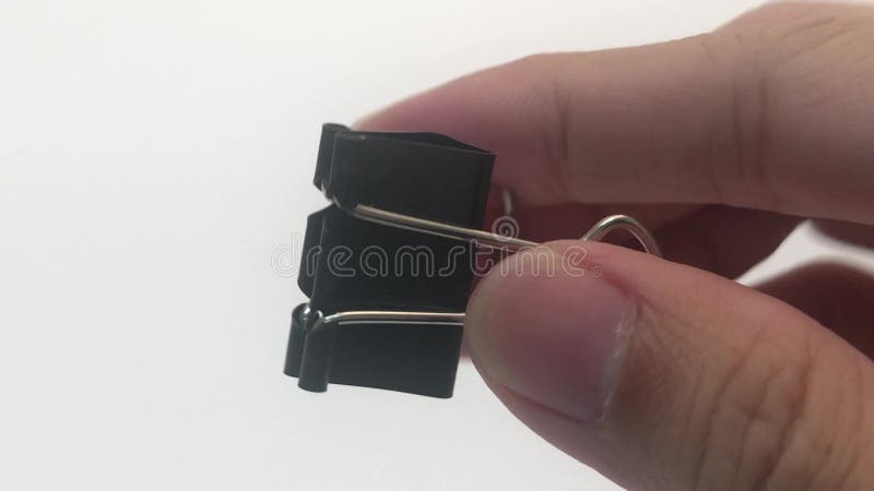 Black Paper Clips on White Background Stock Footage - Video of macro ...
