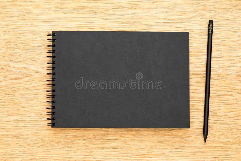 Black Paper Notebook on Oak Wood Desk Background Stock Image - Image of ...