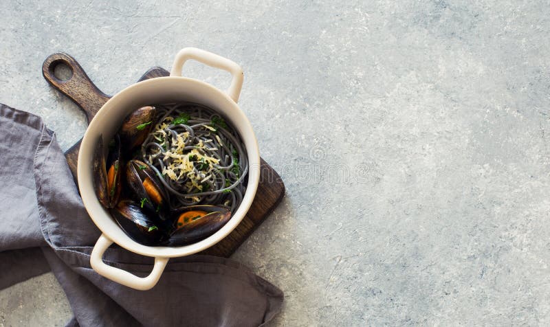 Black Pasta and Mussels in Shell in a Pot Stock Photo - Image of black ...