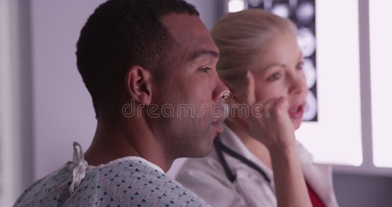 Black Patient Listening To Doctor Explain Test Results Stock Video ... Black Patient Listening To Doctor Explain Test Results Stock Video ...