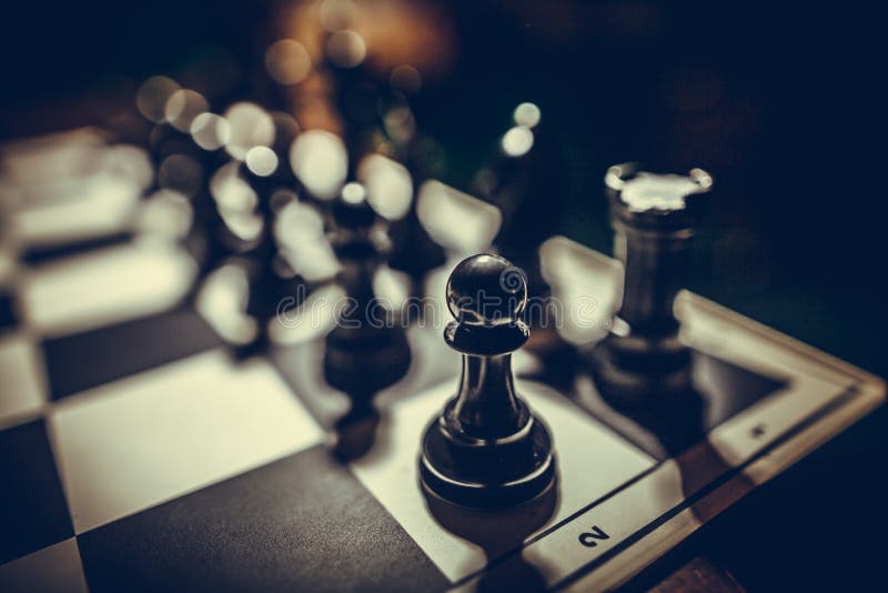 Black pawn on chess board stock photo. Image of chessboard - 89631958