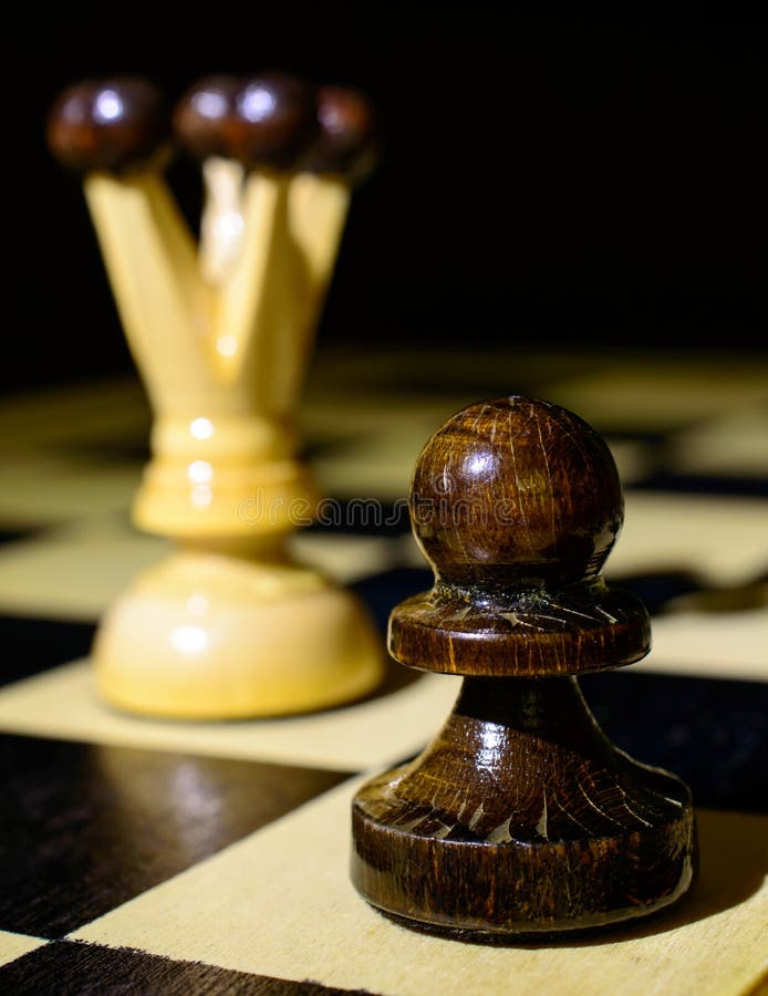 Black Pawn and White Queen on a Chessboard. Stock Photo - Image of ...